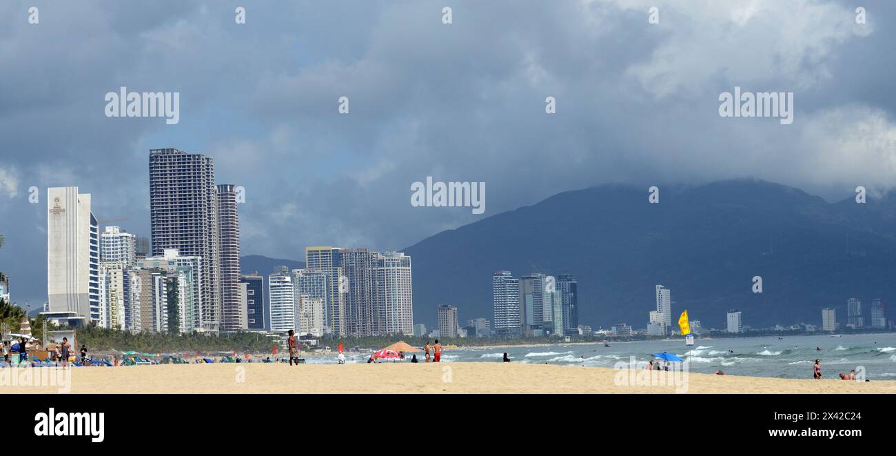 The beautiful long white sand beach along the changing waterfront ...