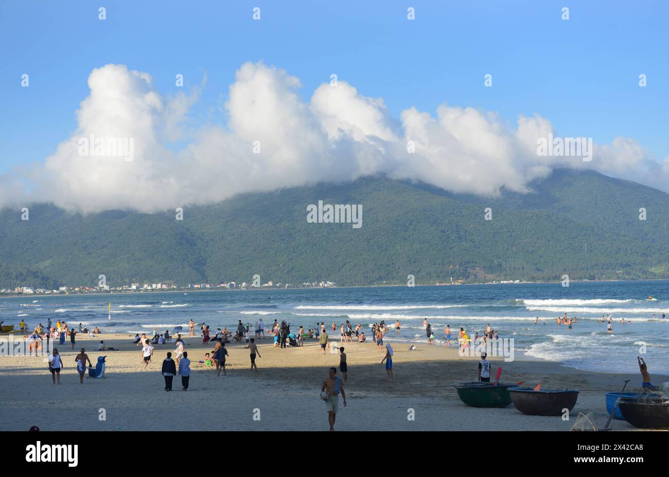 The beautiful long white sand beach along the changing waterfront ...