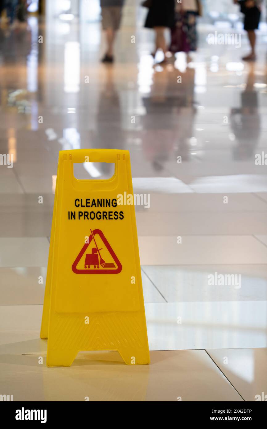 Sign showing cleaning in progress in the shopping mall Stock Photo - Alamy