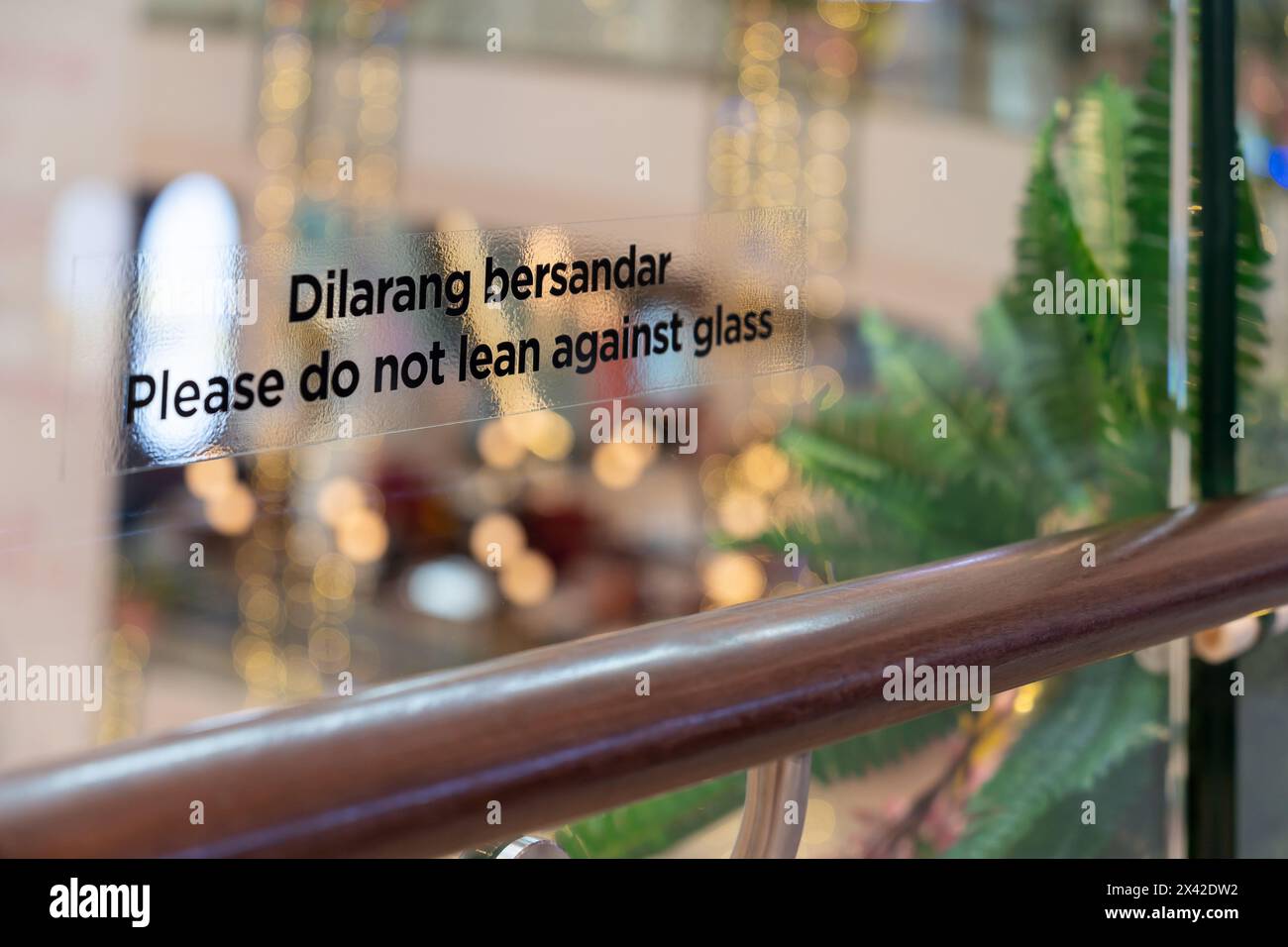 "Please Do Not Lean Against Glass" sticker on the glass railing Stock ...