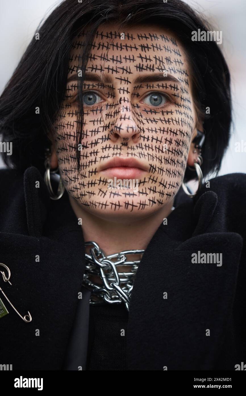 Portrait of Ukrainian woman with face painting dedicated to captured ...