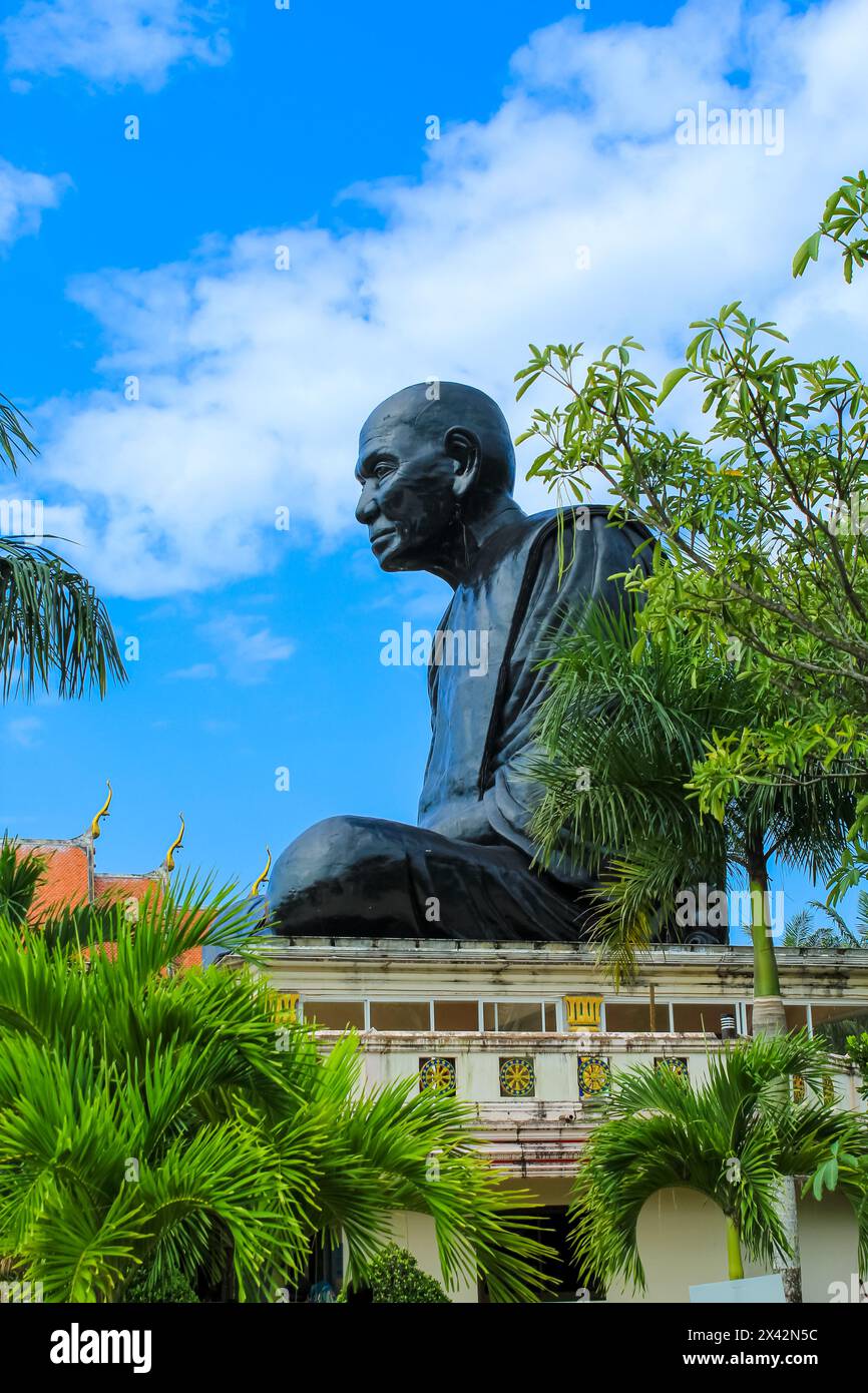 The majestic statue of an enlightened monk in the lotus position at the ...