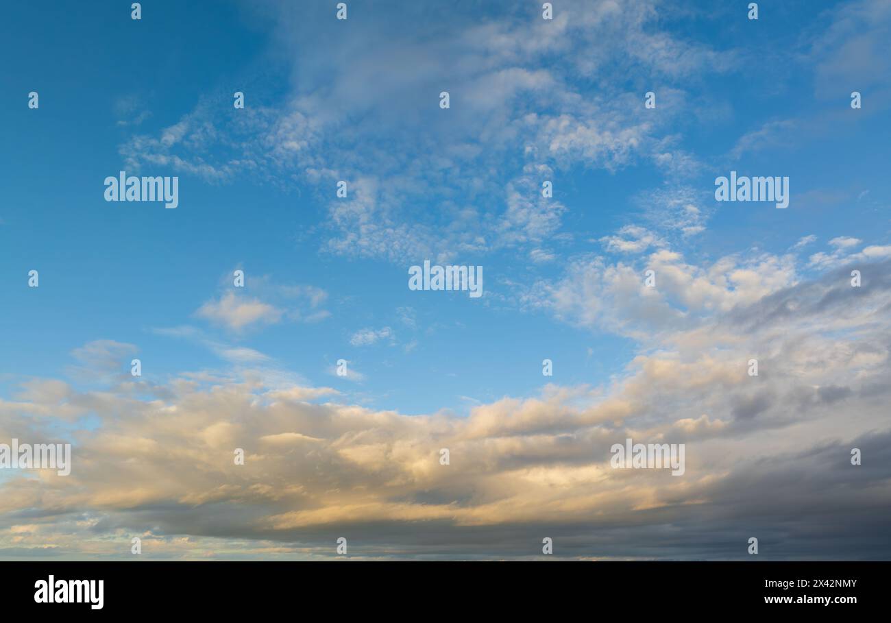 blue sky, golden clouds and other gray rain clouds Stock Photo - Alamy