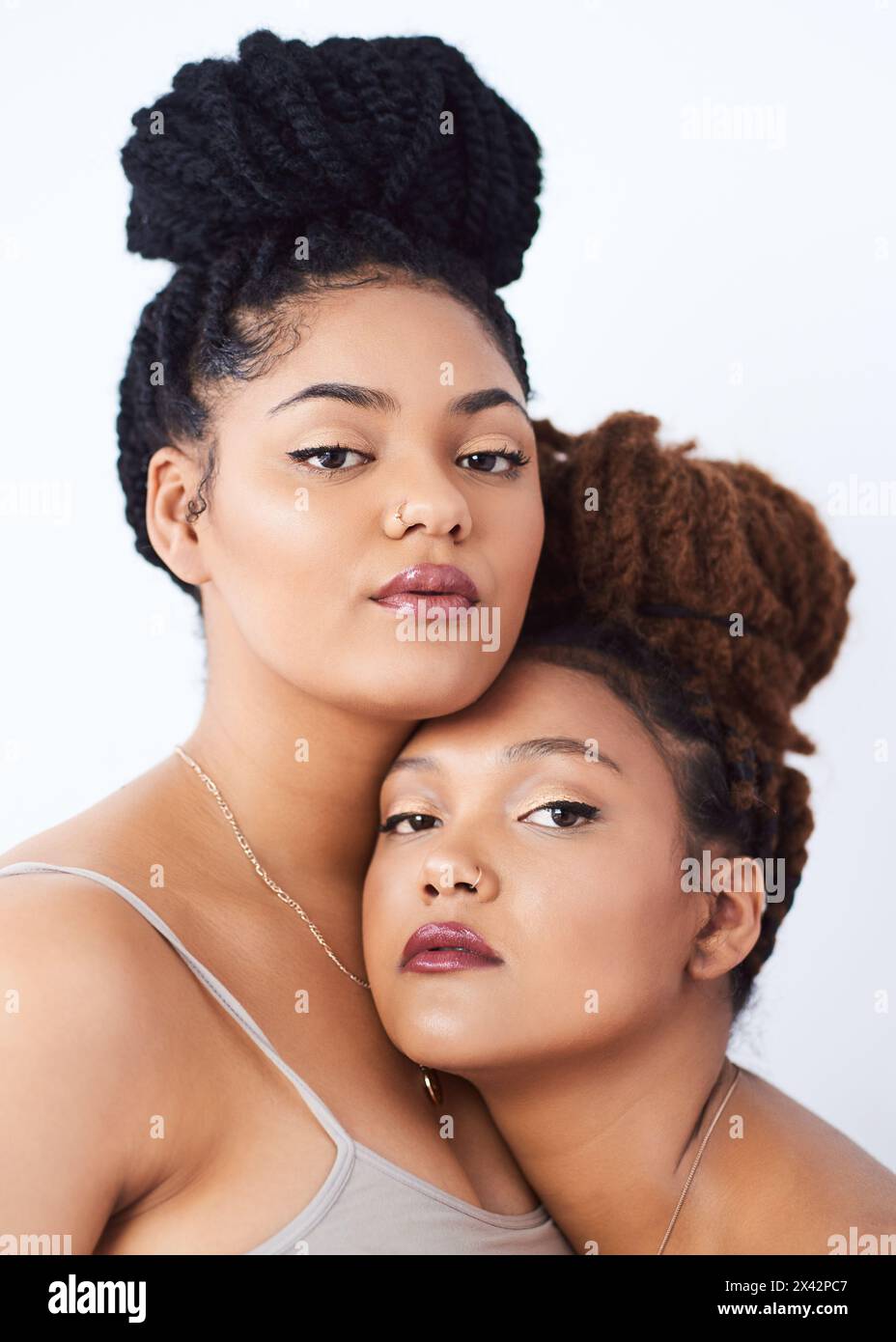 Sisters, portrait and cosmetics in studio, hug and luxury makeup ...