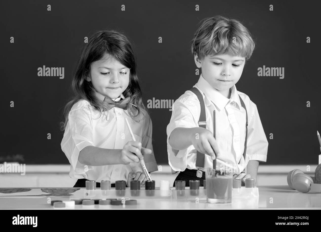 Kids doing homework on Black and White Stock Photos & Images - Alamy