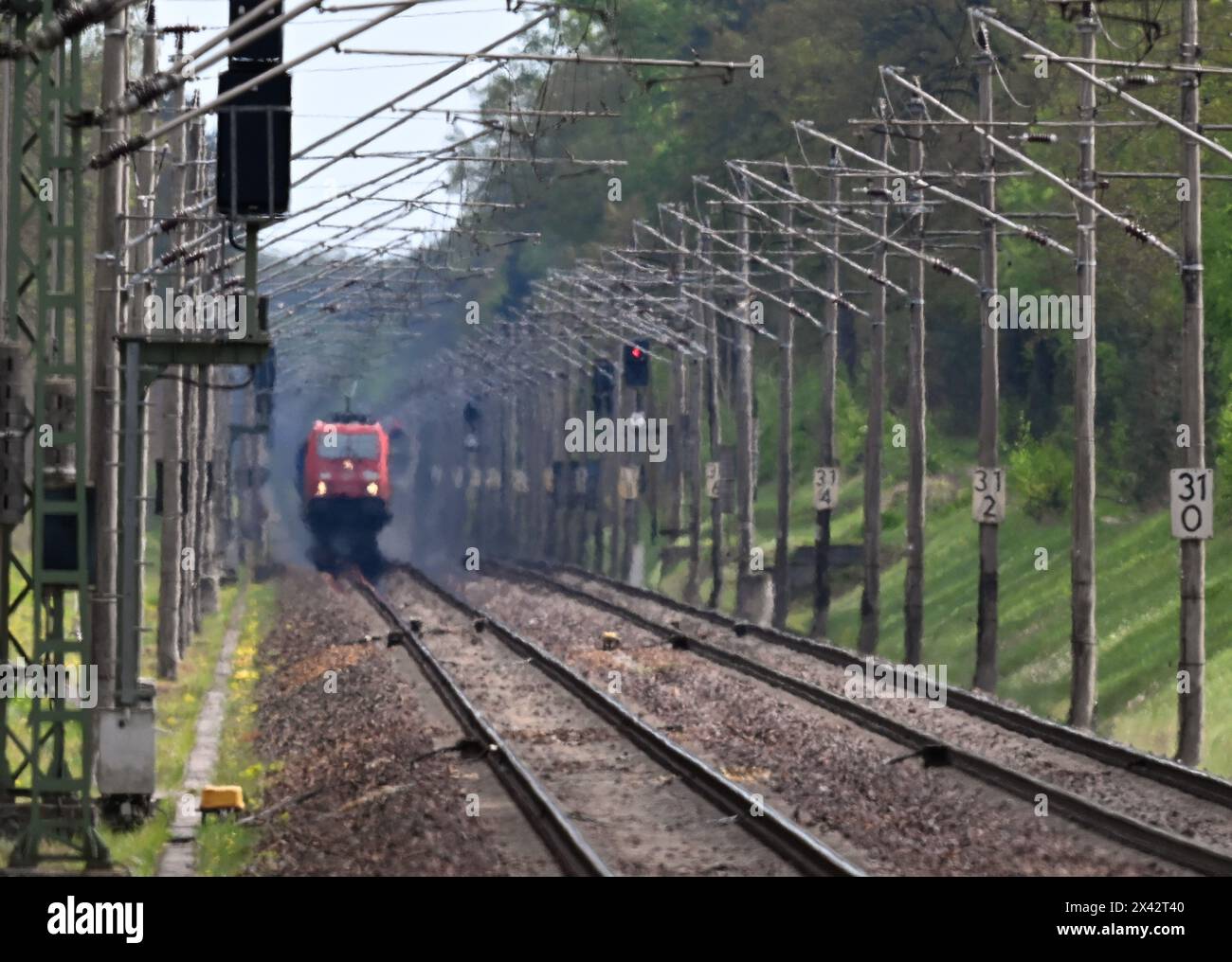 29 April 2024, Brandenburg, Grünheide (Mark): A freight train of bulk ...