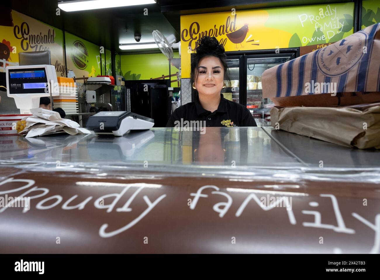 Shopkeeper at the counter of the Emerald Hill Poultry stall at the ...