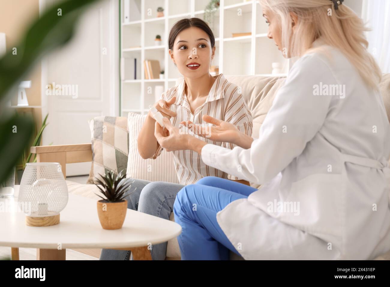 Medical assistant taking asian patient hi-res stock photography and ...