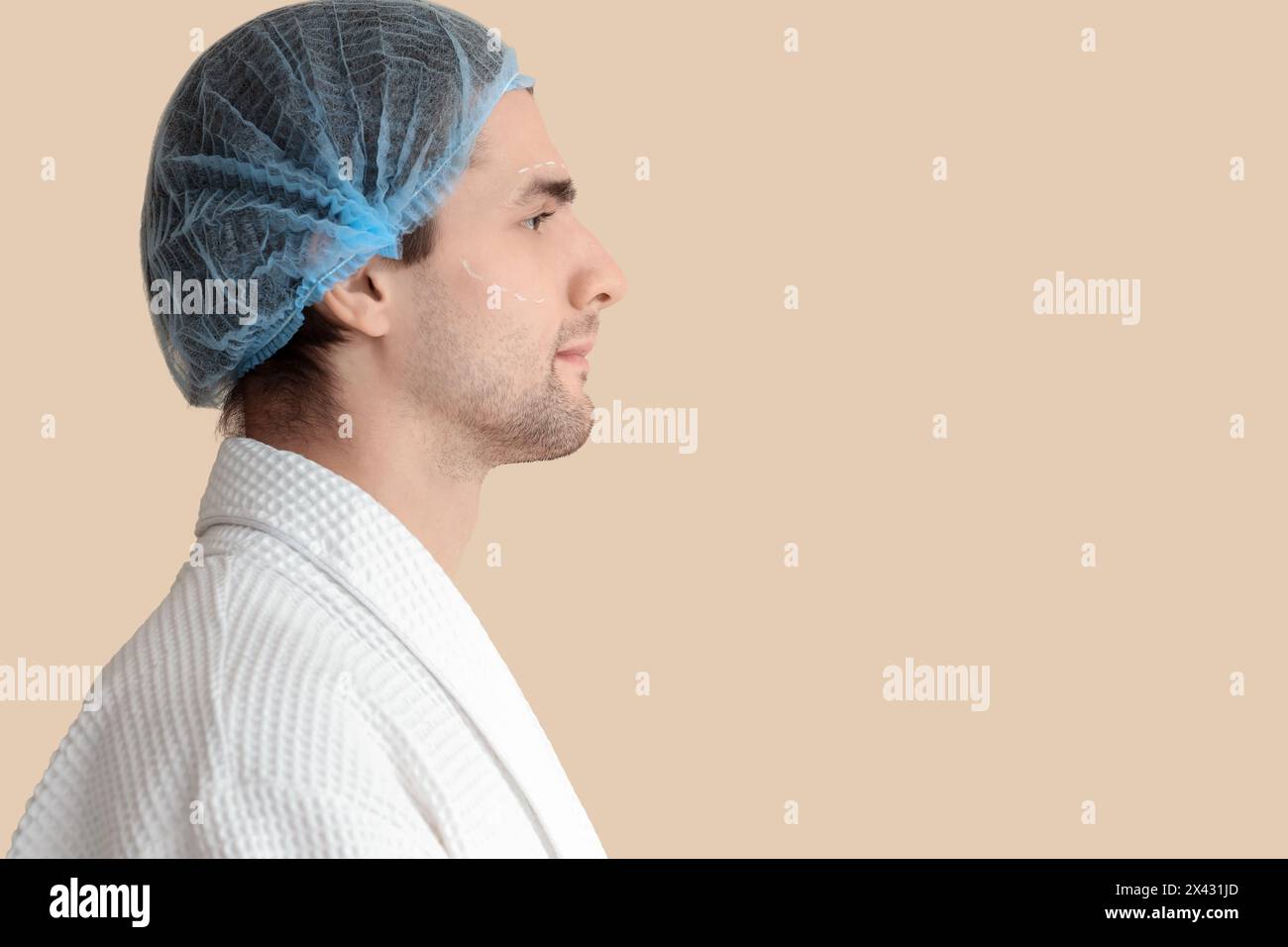 Handsome man with marked face on beige background, closeup. Plastic ...