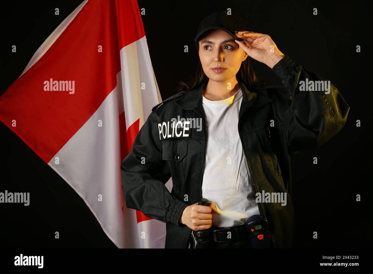 Female police officer and flag of Canada on black background Stock ...