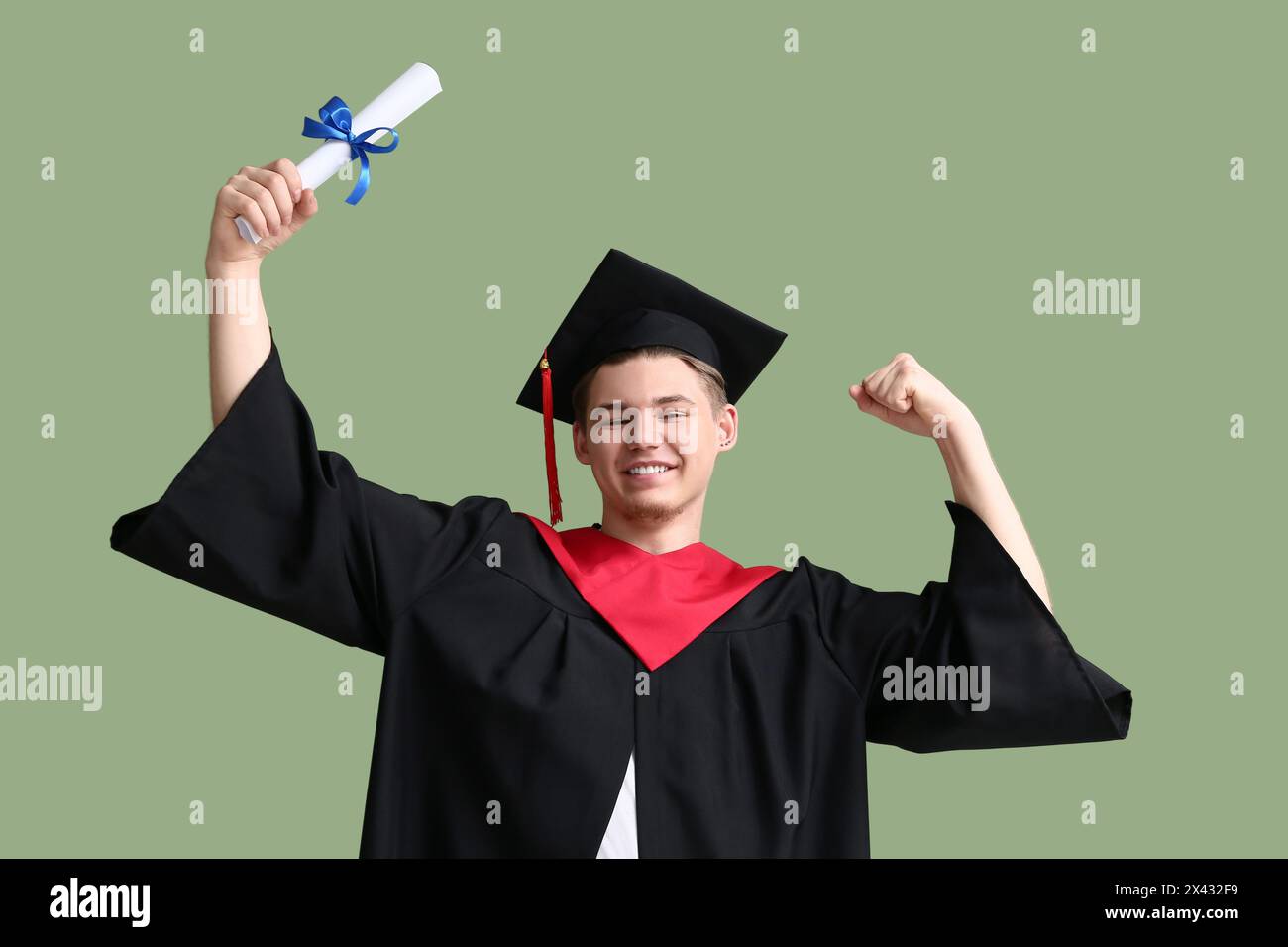 Happy male graduate with diploma on green background Stock Photo - Alamy