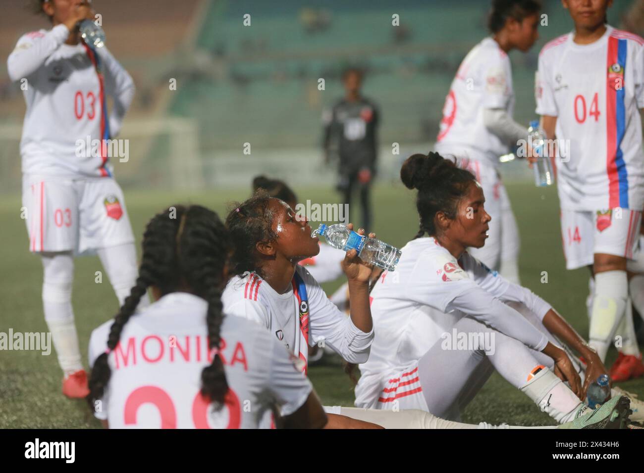 Dhaka Rangers FC players sip water during a cooling break to avoid ...
