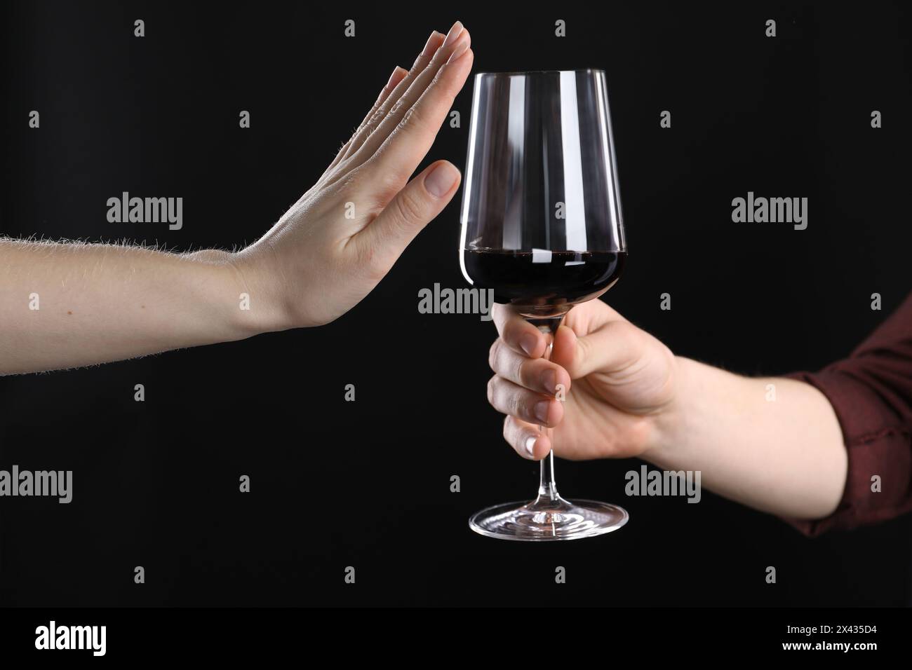 Alcohol addiction. Woman refusing glass of wine on black background ...