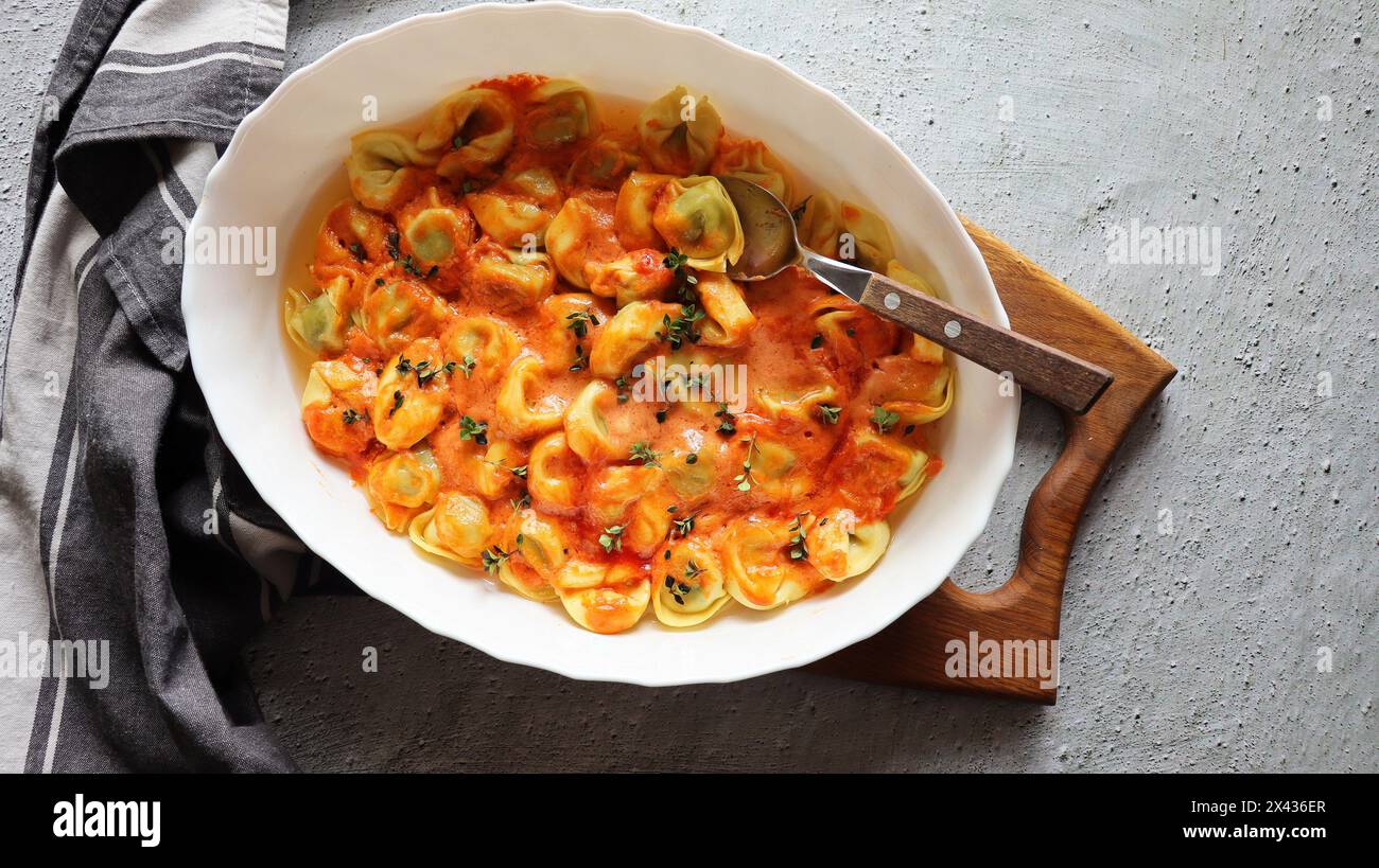 Tortelloni pasta witch riccota , spinach and creamy tomato sauce Stock ...