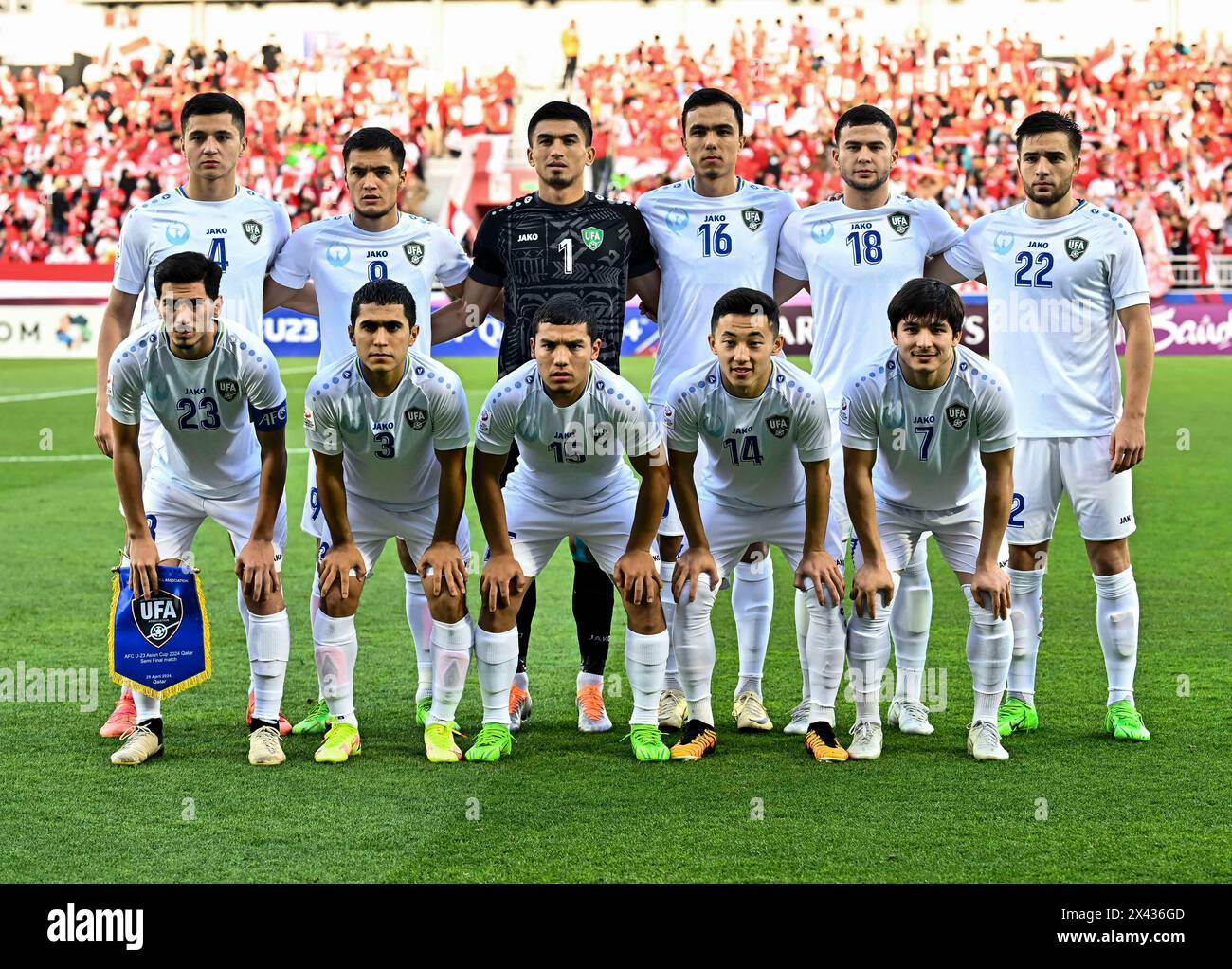 Doha, Qatar. 29th Apr, 2024. Starting players of Uzbekistan pose prior ...