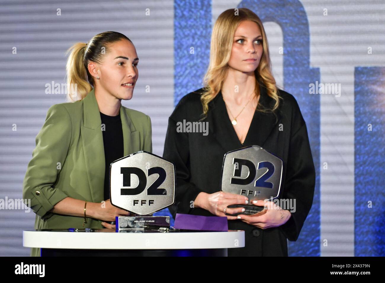FC Nantes' goalkeeper Emily Rachael (R) wins the Best Goalkeeper trophy ...