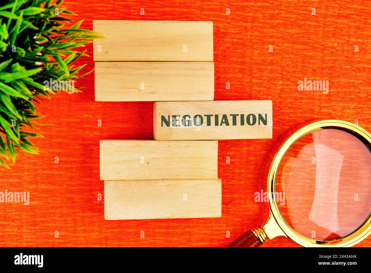 Business concept. Negotiation word on wooden blocks on a red background ...