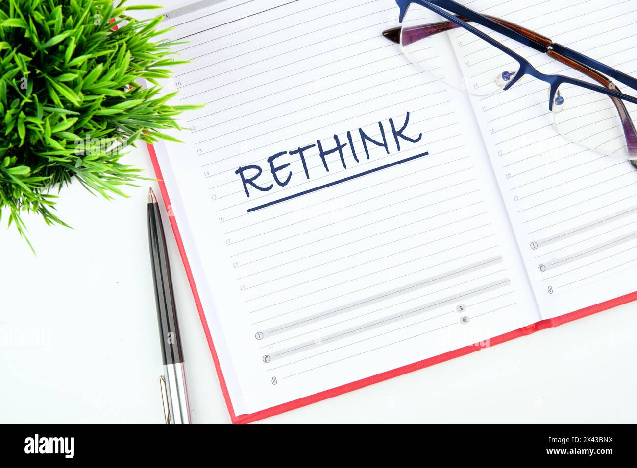 Business, rethinking and rebranding concept. Word Rethink written in an ...