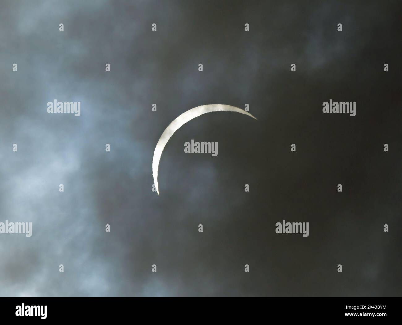 the total solar eclipse of april 9, 2024, as seen through the clouds ...