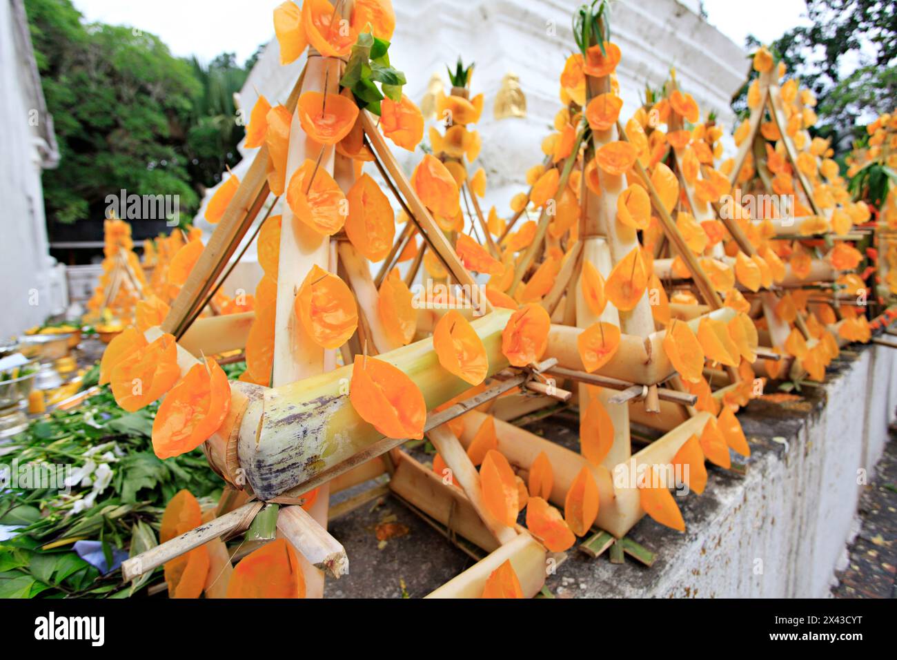 Sacred ritual offering phueng trees (bee trees) and candle trees to pay ...