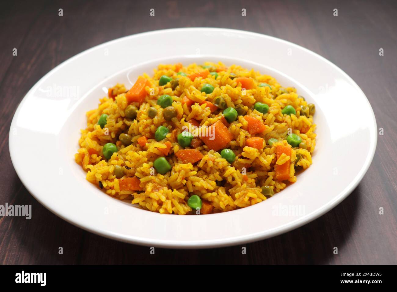 Carrots and Peas Pilaf or Gajar Matar Pulao. It is a one pot rice dish ...