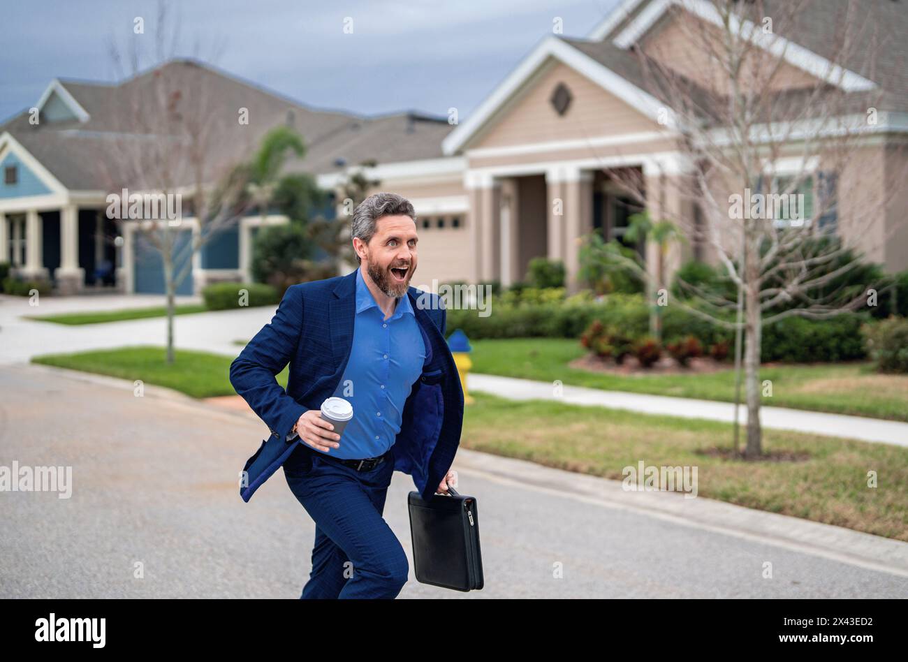 Business man run near house in american neighborhood. Businessman run ...