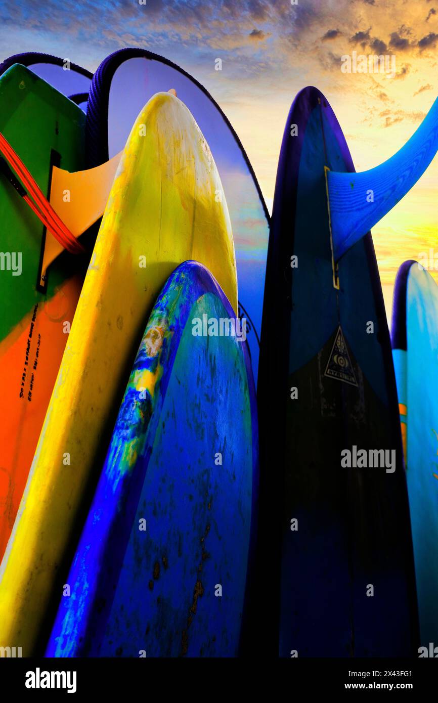 Stacked surf boards at sunset after a day of surf school in Canggu ...