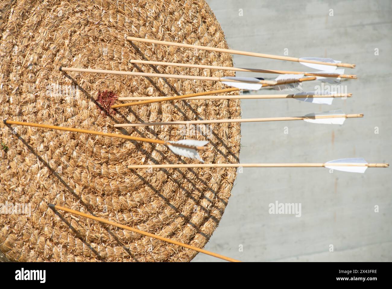 Straw Archery Target With Arrows Stock Photo - Alamy