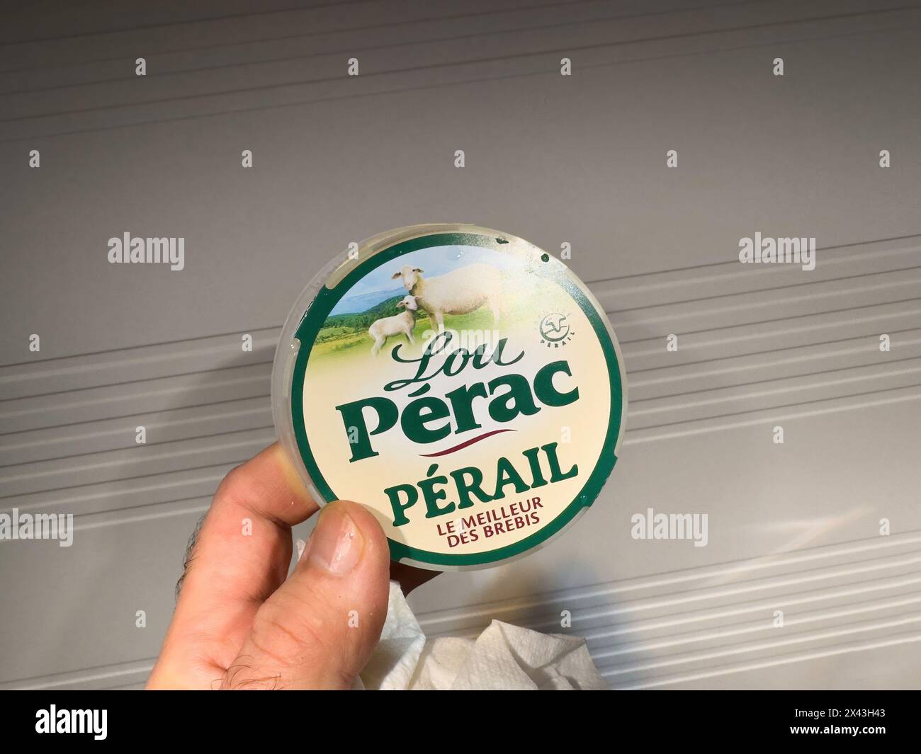 Paris, France - Mar 8, 2024: Personal perspective - hand presents a ...