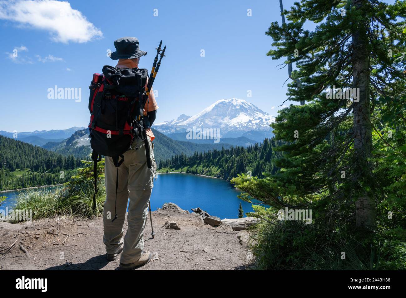 Backpacker enjoying the views of beautiful Summit lake and Mount ...