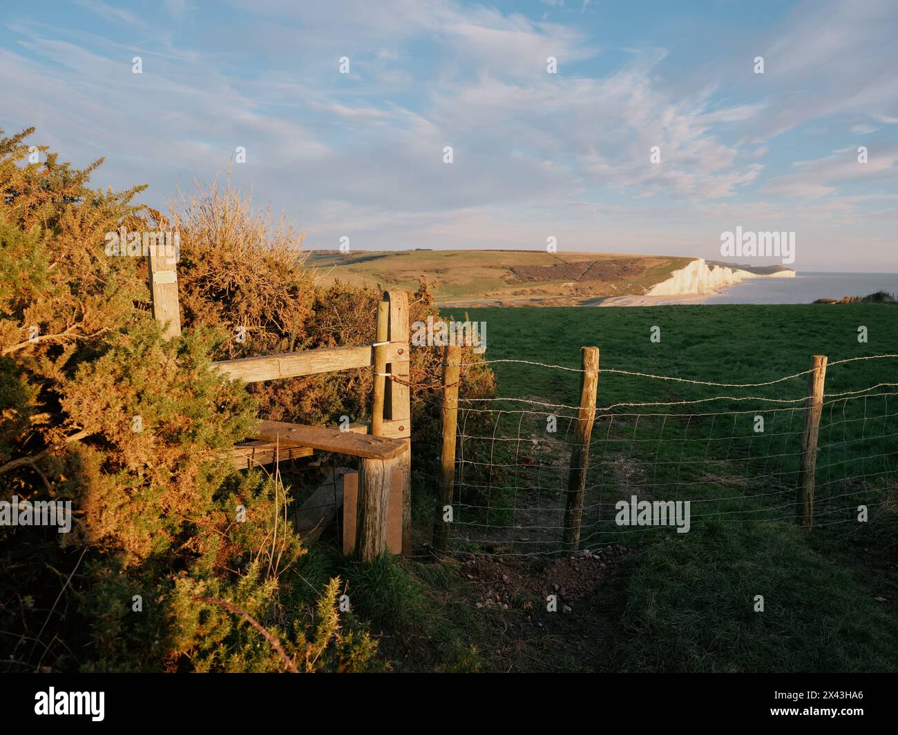 The East Sussex landscape with stile at Cuckmere Haven, Seaford Head ...