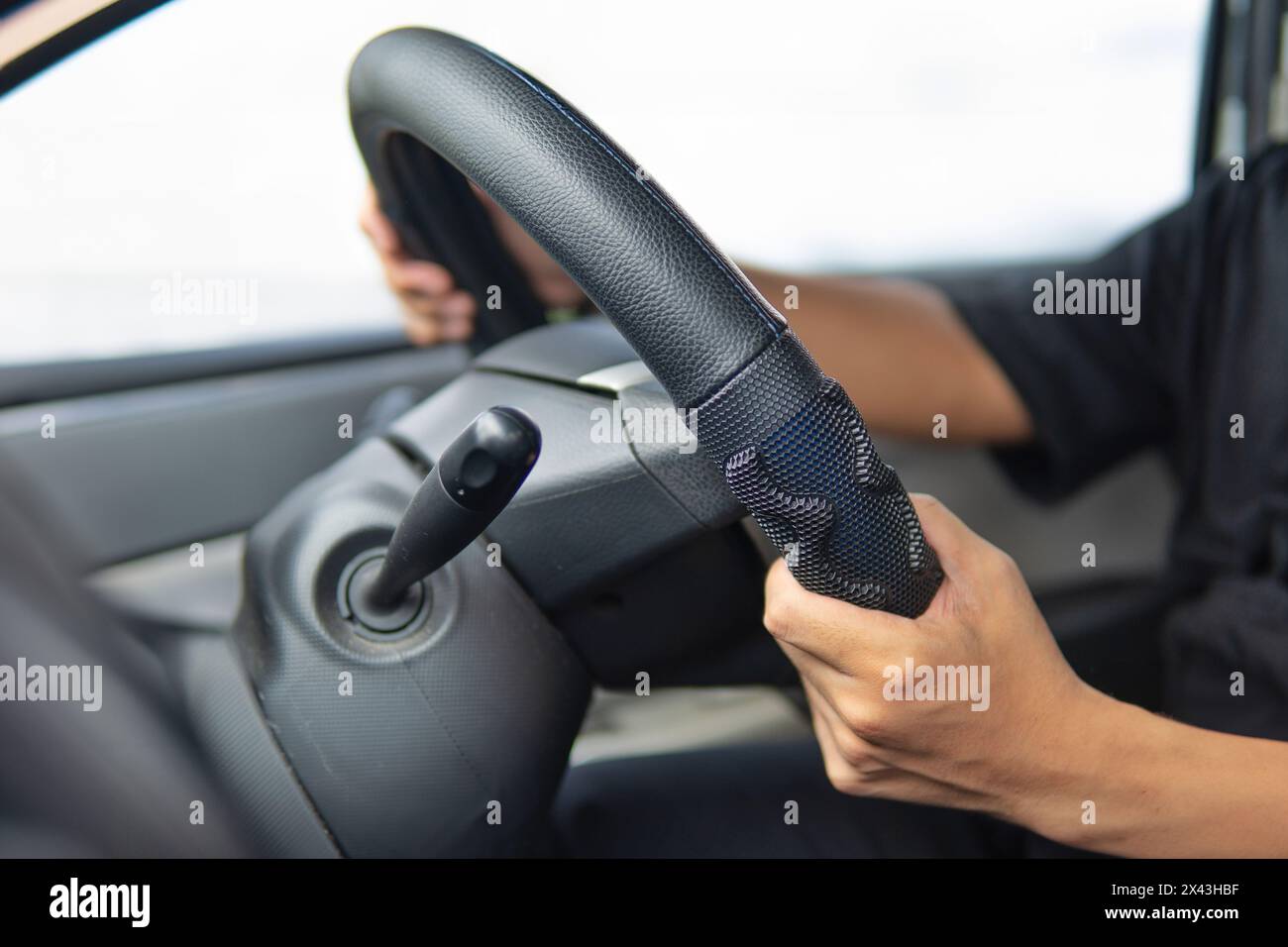 Closeup image of male driver hands holding steering wheel Stock Photo ...