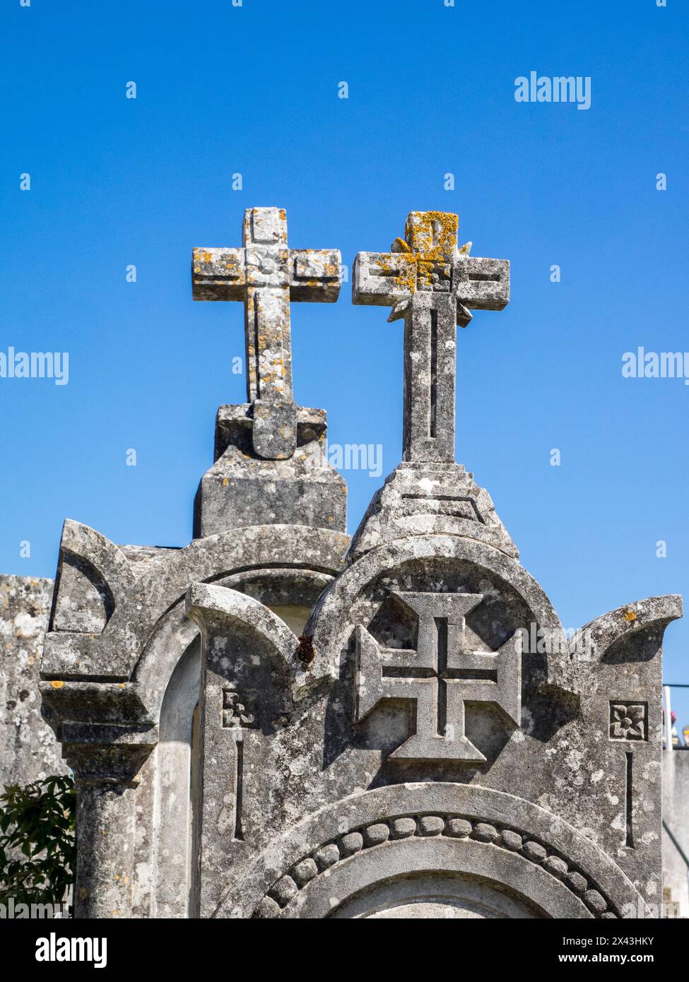 Cross at the top of an ancient gravestone in the cemetery at the ...