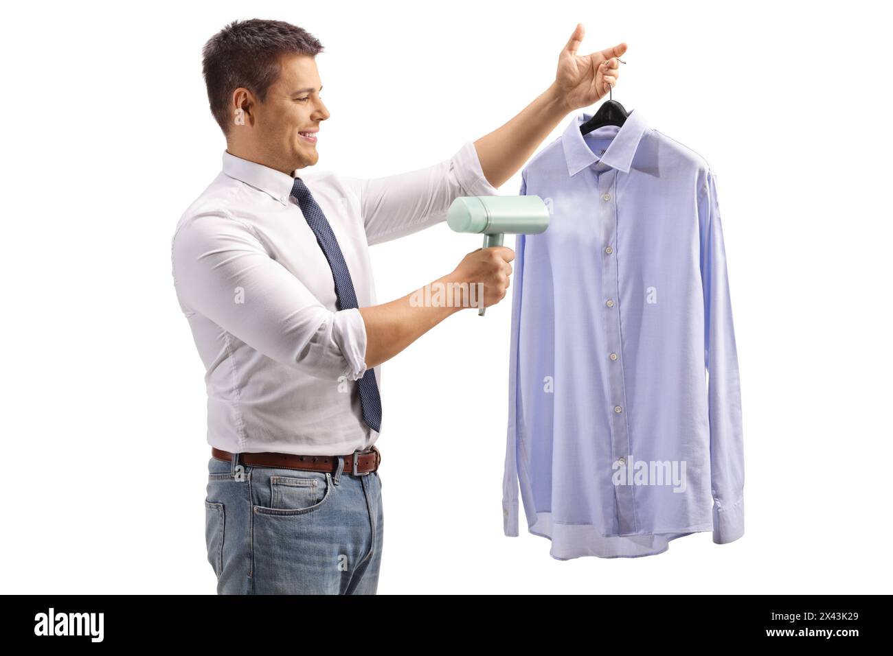 Using manual steamer ironing clothes hi-res stock photography and ...