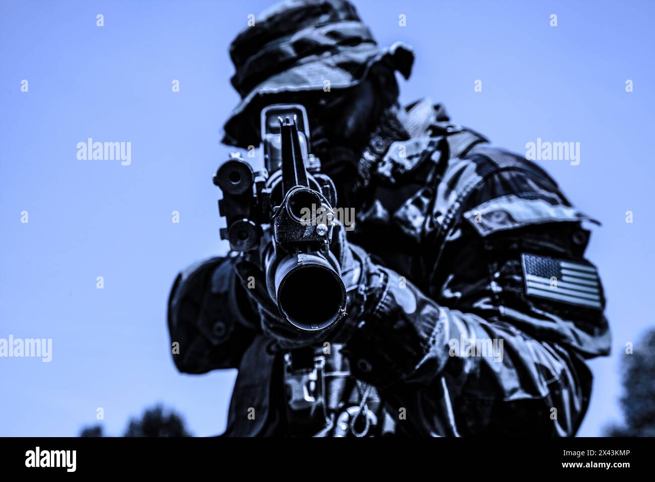 Special forces soldier aiming his rifle pointing aiming at objective ...