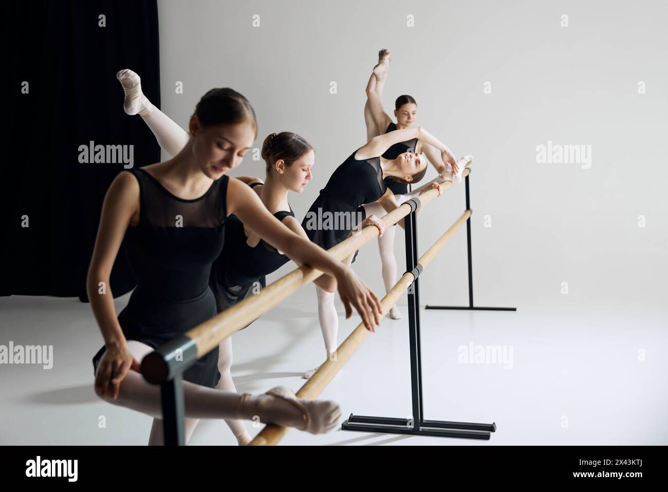 Studio ballet practice. Elegant teen girls practicing at dance class ...