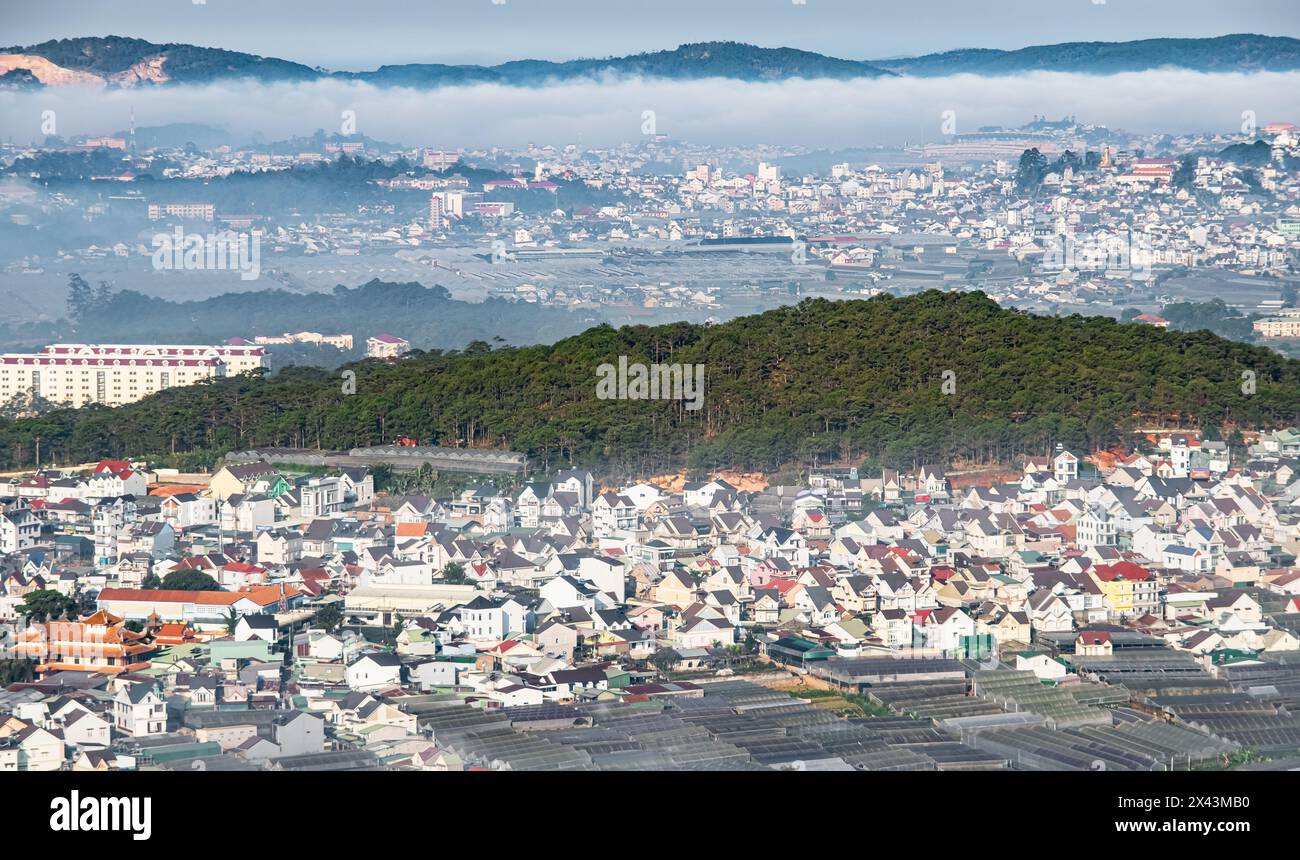 The morning landscape in the valley Da Lat, Vietnam with fog covered ...