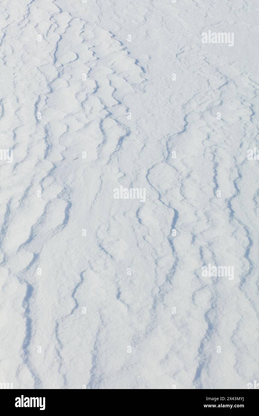 Wind has made patterns on snow surface Stock Photo - Alamy