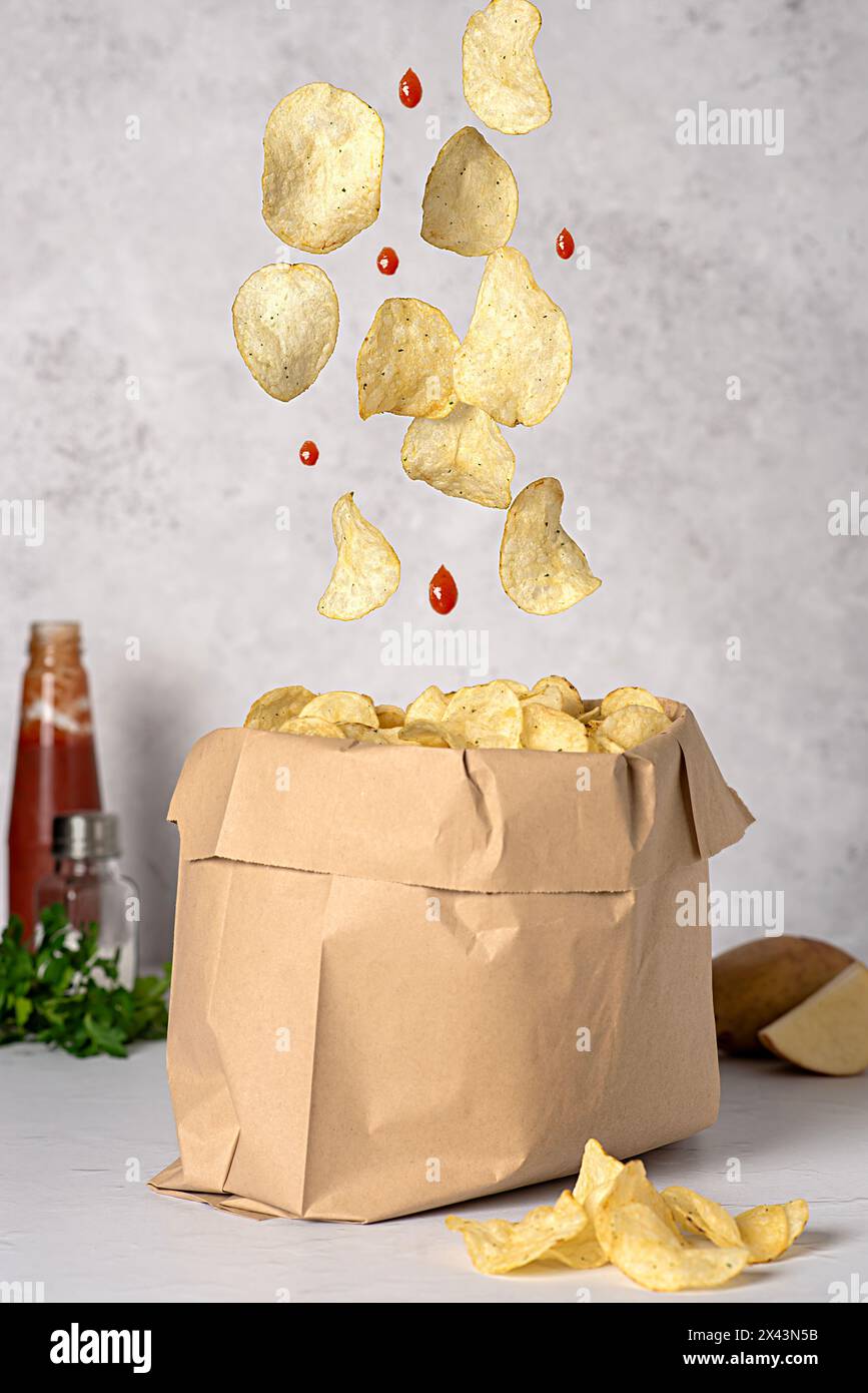 Food photography of potato crisp; potato chips; crunchy; crispy; salted ...