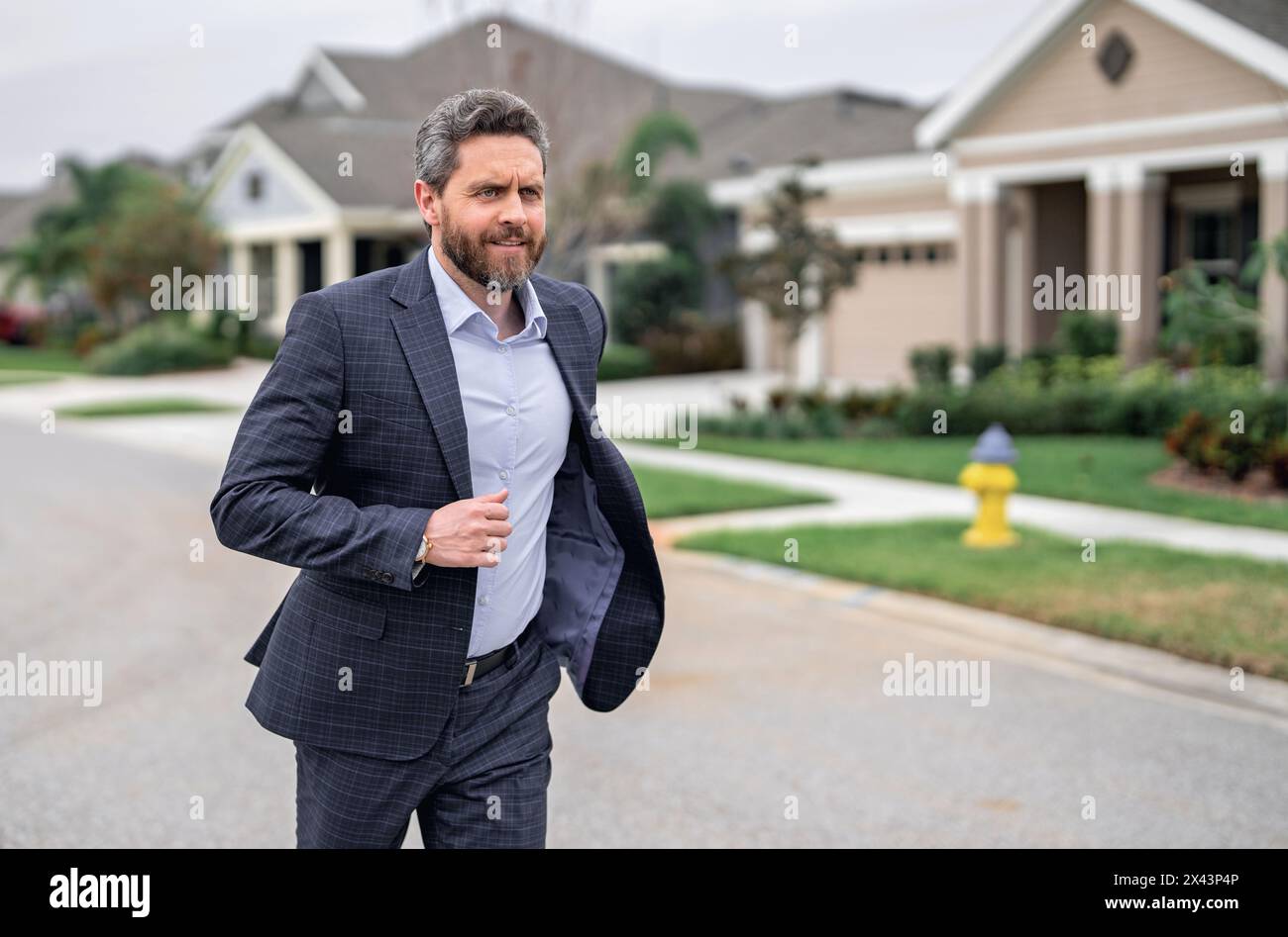 Business man run near house in american neighborhood. Businessman run ...
