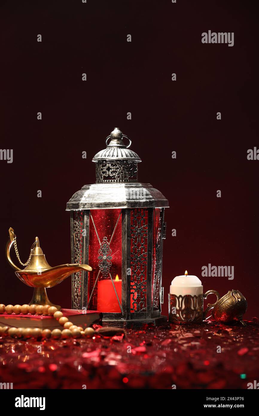 Arabic lantern, Quran, misbaha, burning candle and Aladdin magic lamp ...