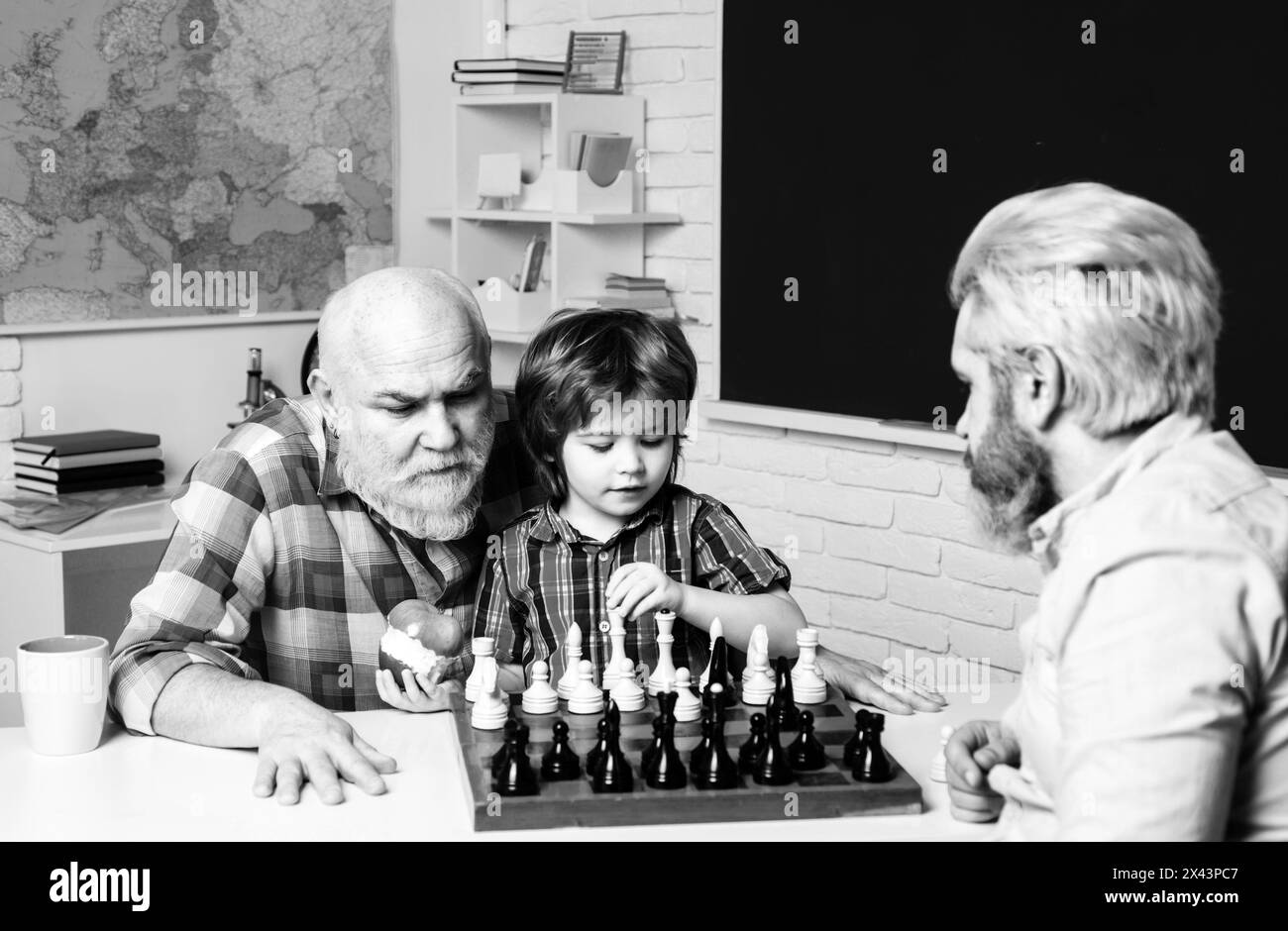 Father and son playing in school class. Happy smiling grandson boy with ...