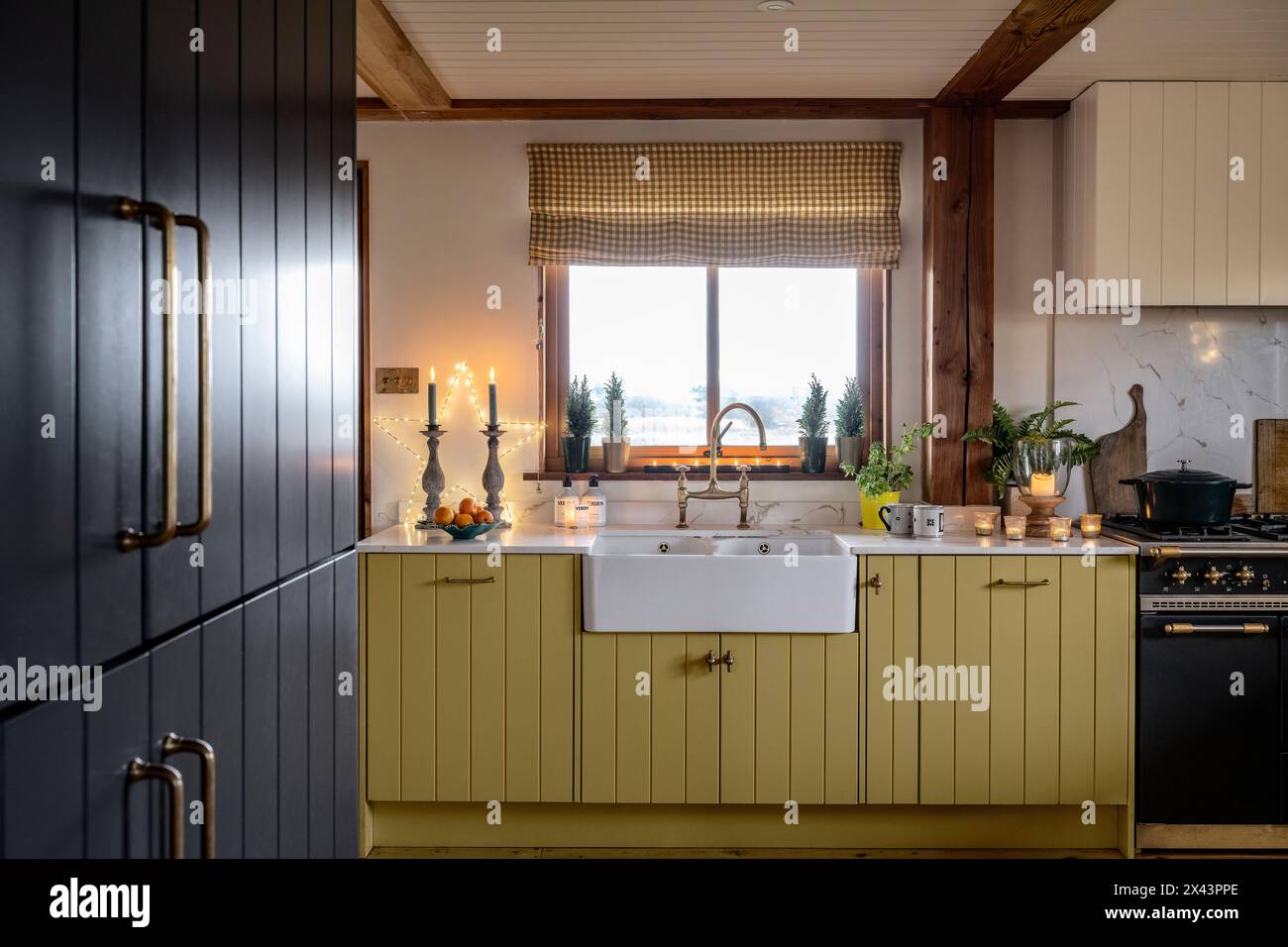Belfast sink at window in East Sussex fitted kitchen, South East ...