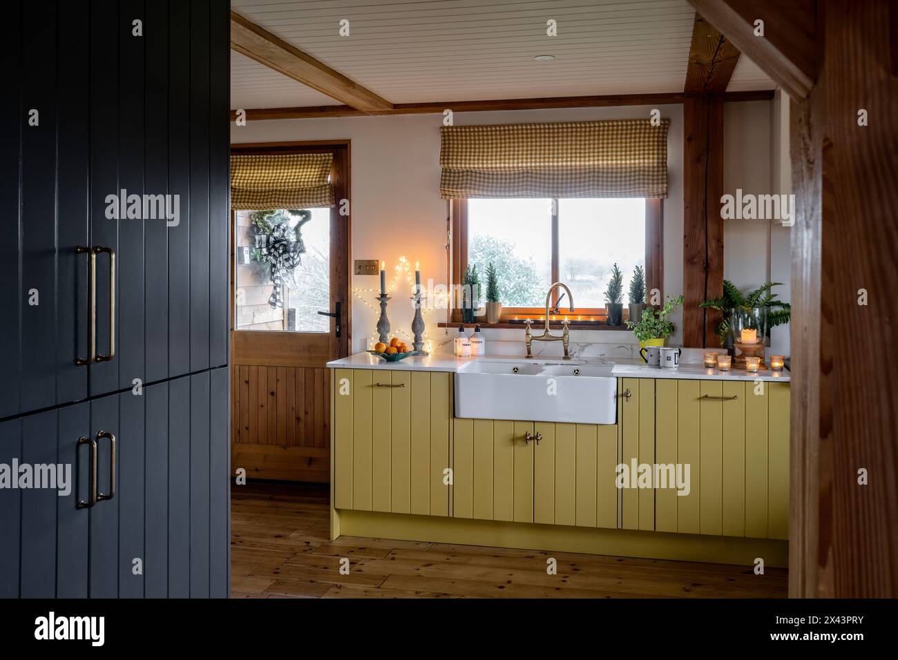 Belfast sink at window in fitted East Sussex kitchen, South East ...