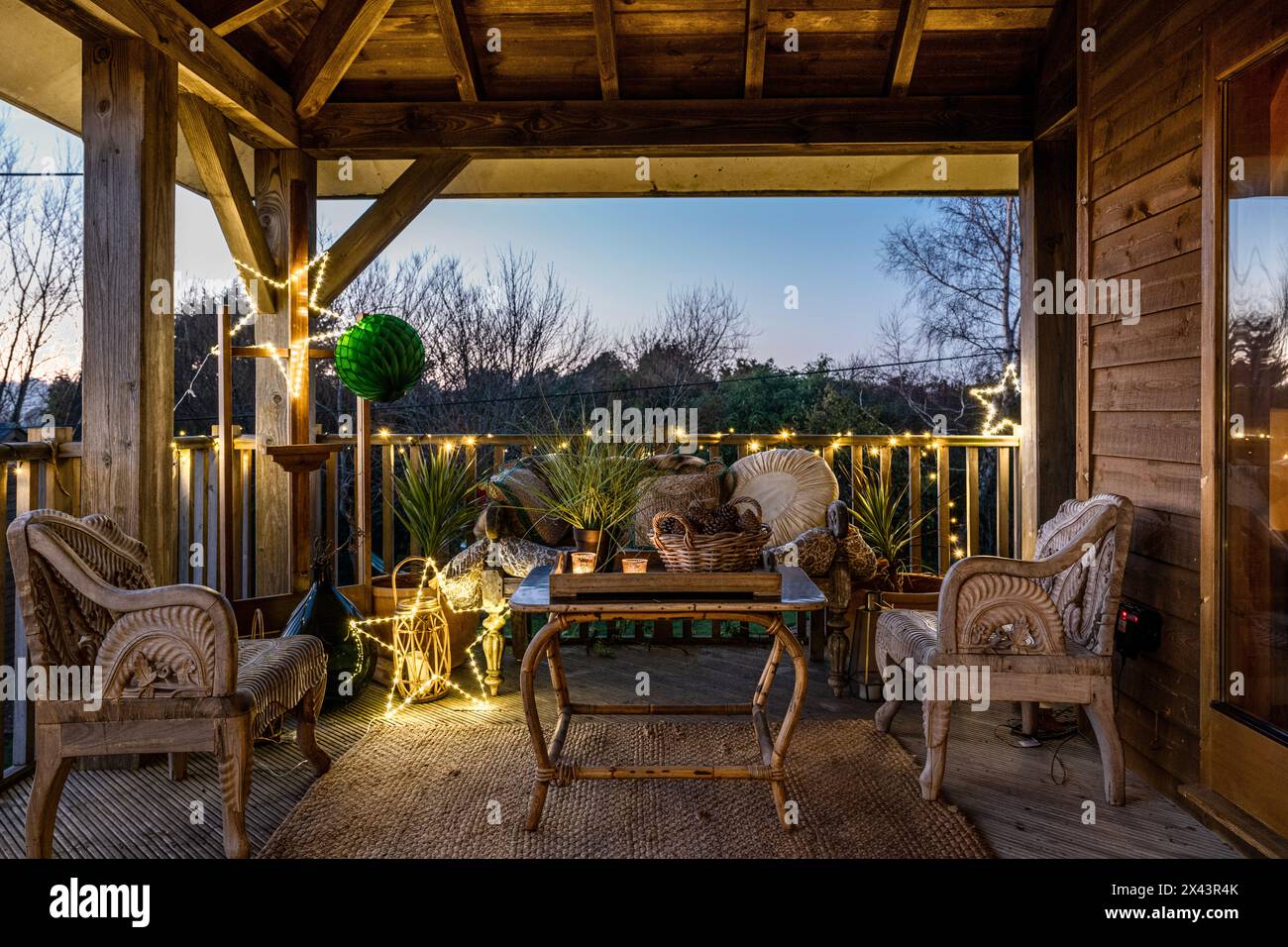 Seating area lit at Christmas outside East Sussex home, South East ...