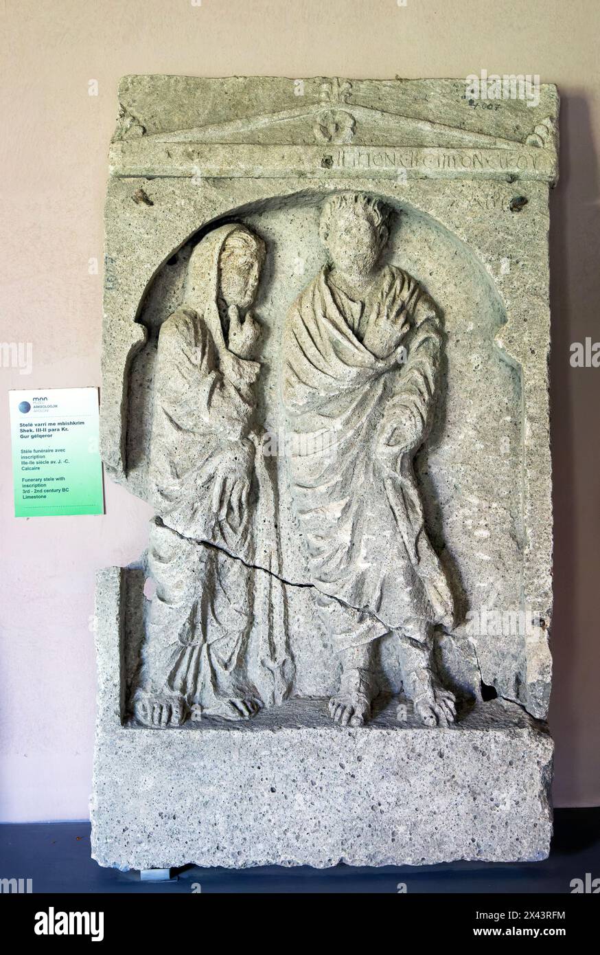 Hellenistic Greek funerary stele carved in limestone of man and woman ...