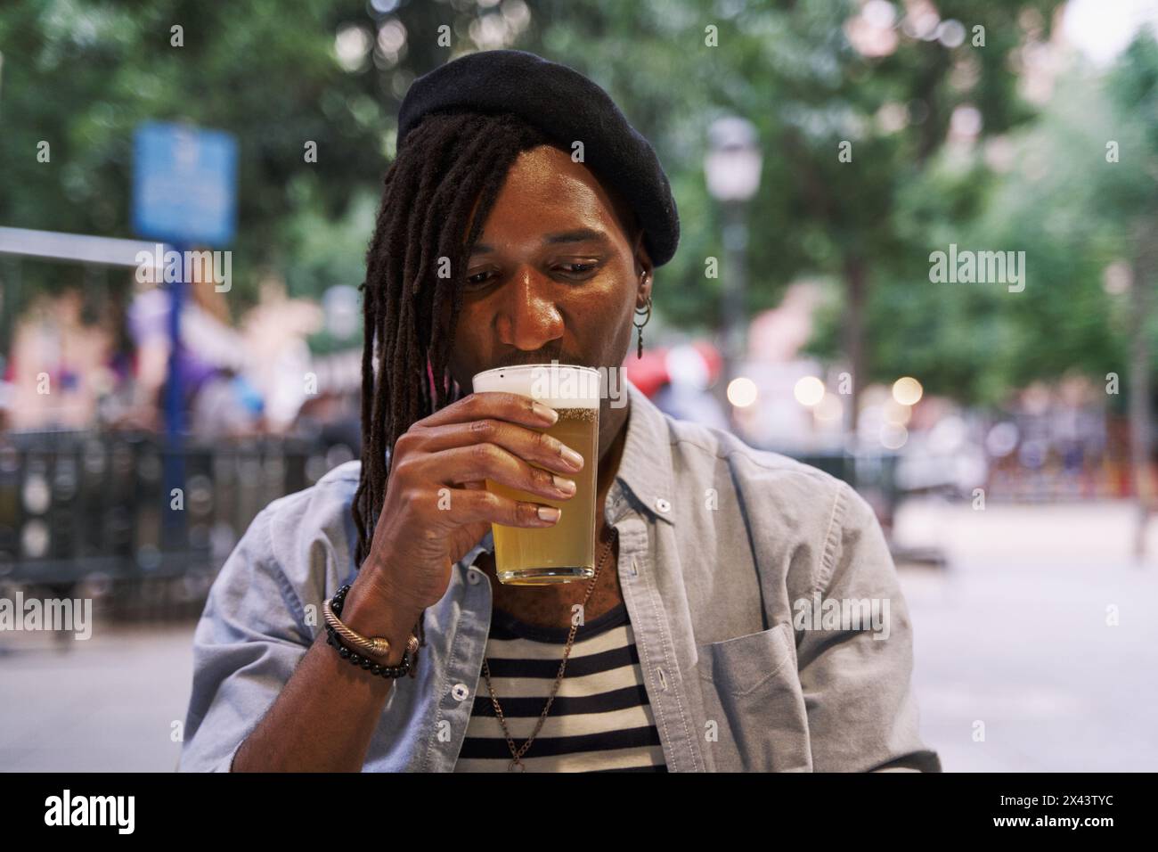 portrait of an African-American man drinking beer in a bar Stock Photo ...