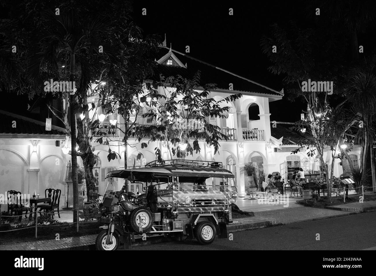 Nighttime street life with French colonial buildings in the historic ...