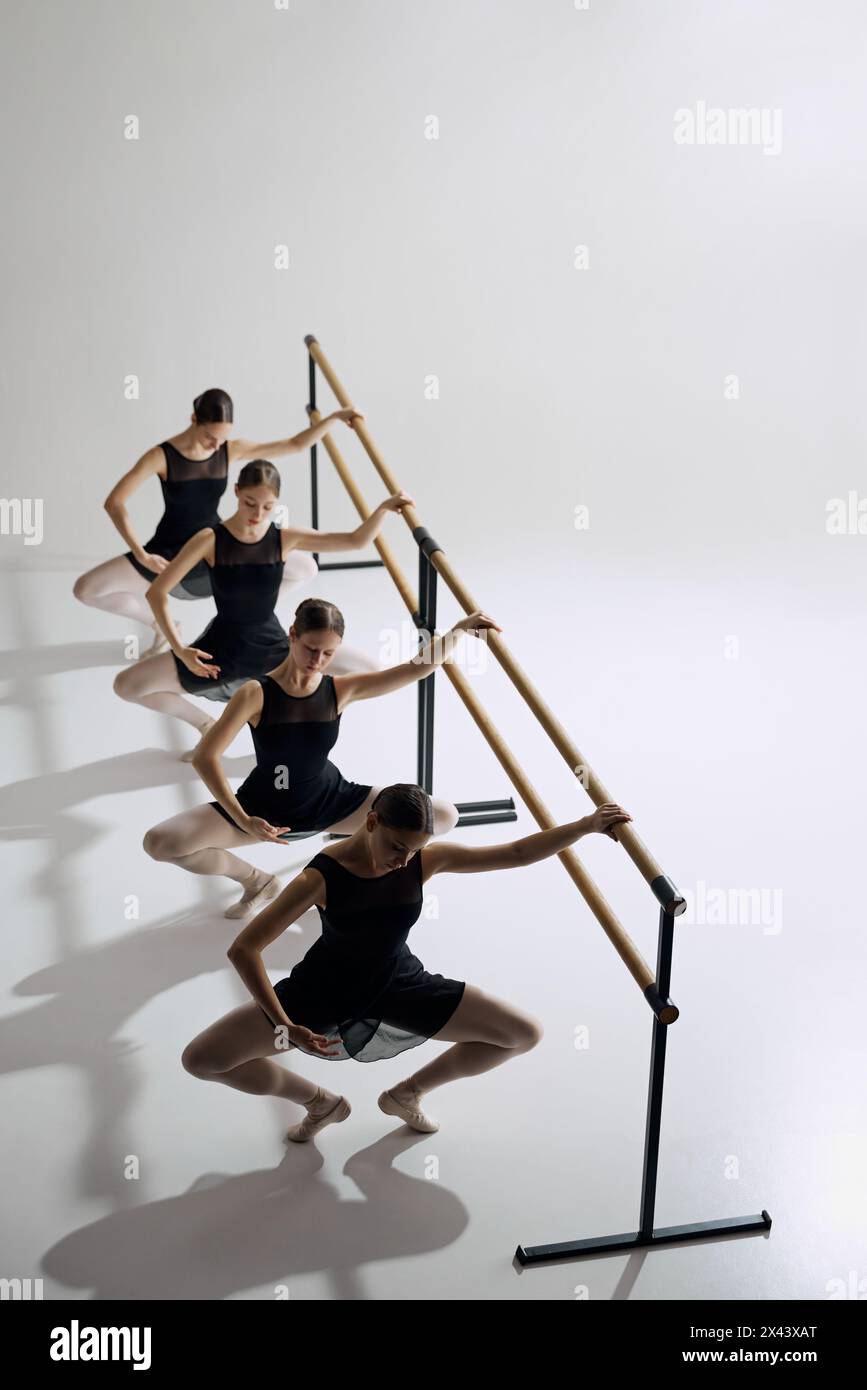 Practicing plie. Top view on for teen girls, elegant ballet dancers in ...