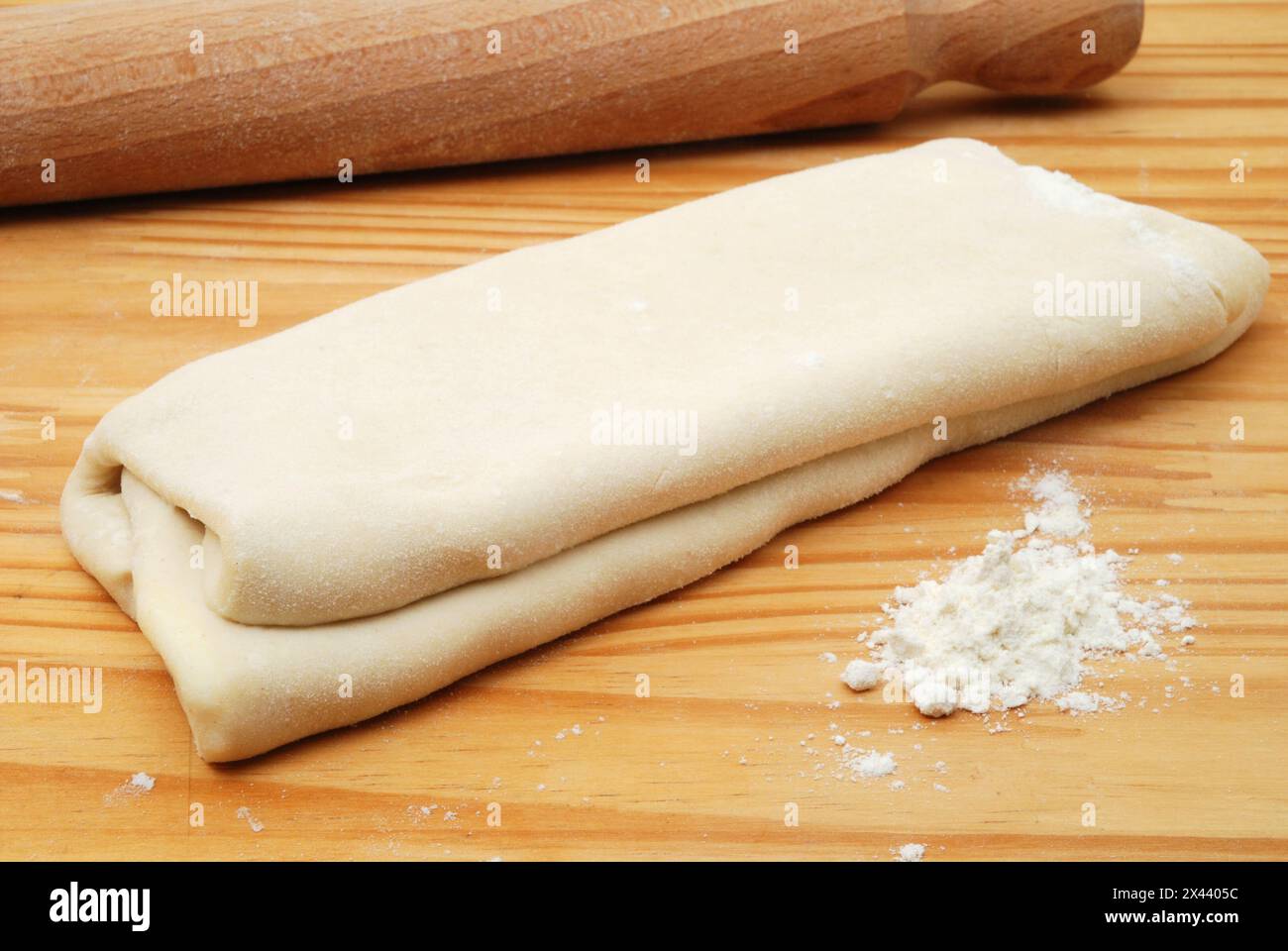 Folded Raw Puff Pastry Dough. Shown from above on a wooden cutting ...